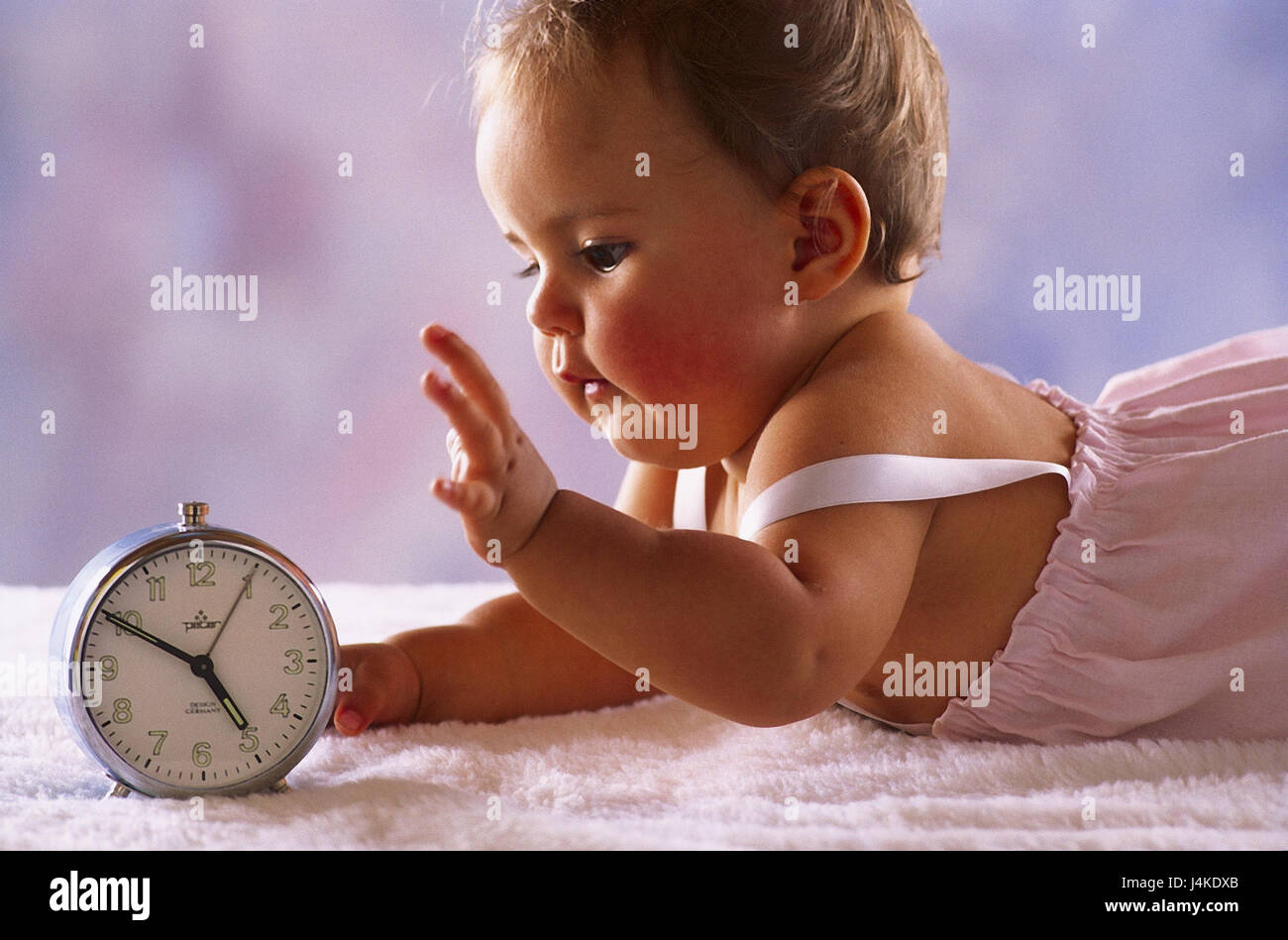 Baby, upper part of the body freely, abdominal position, view alarm ...