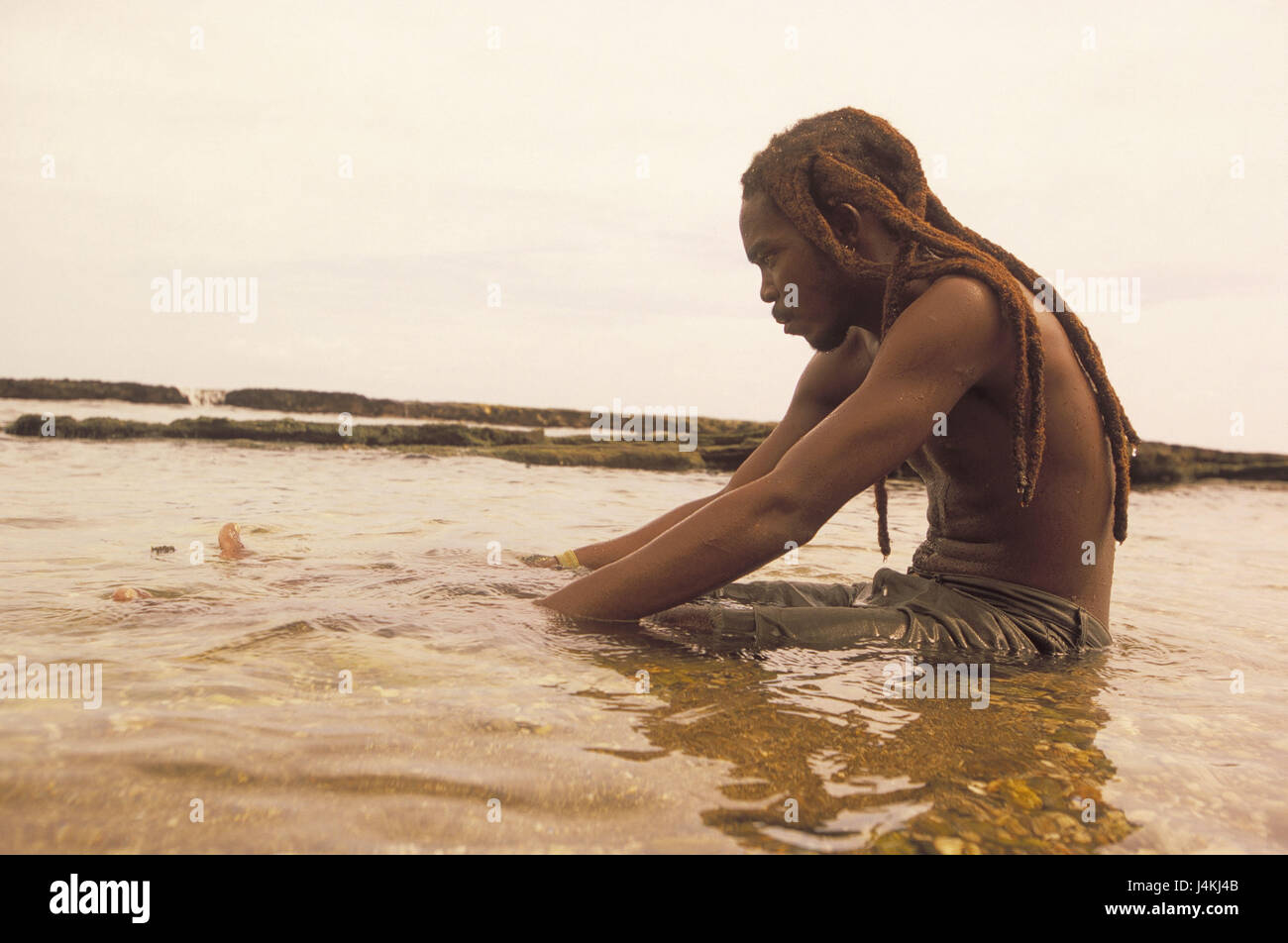 Cuba, Santiago de Cuba, man, dreadlocks, sit, cool sea, refreshment, at ...