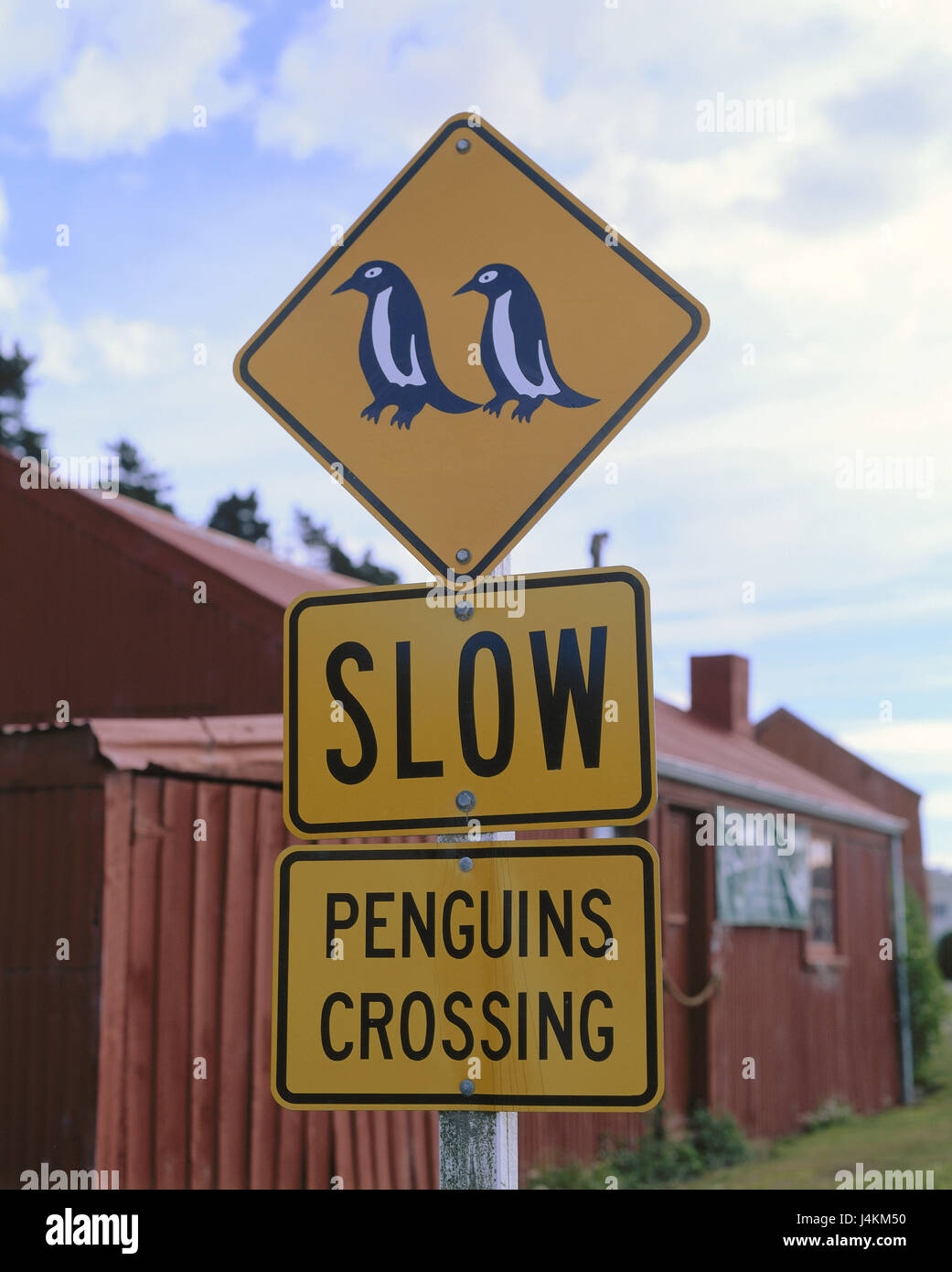 Slow penguins crossing road sign hi-res stock photography and images ...