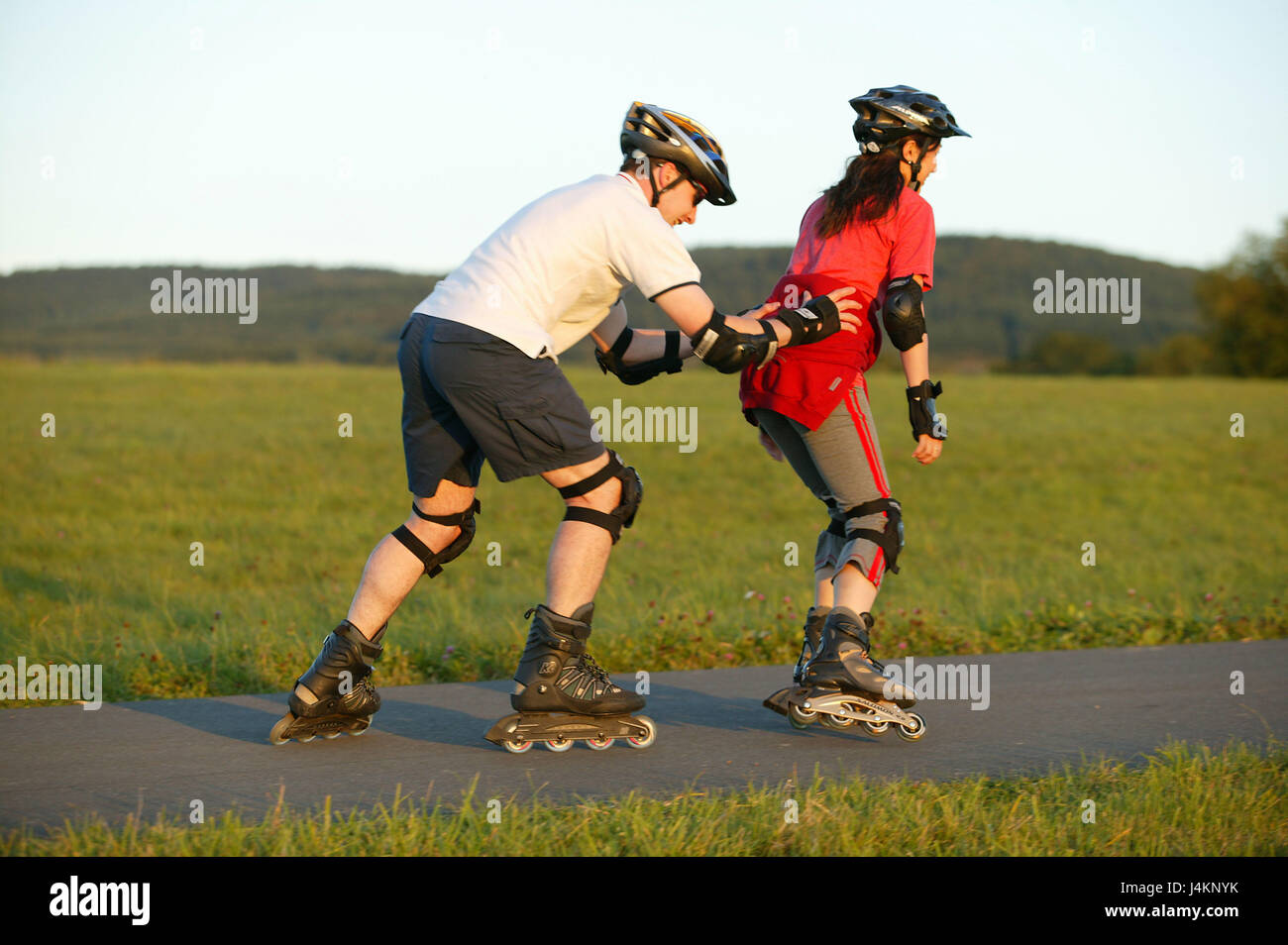 Country road, couple, young, Inlineskaten, man, woman, push, at the ...