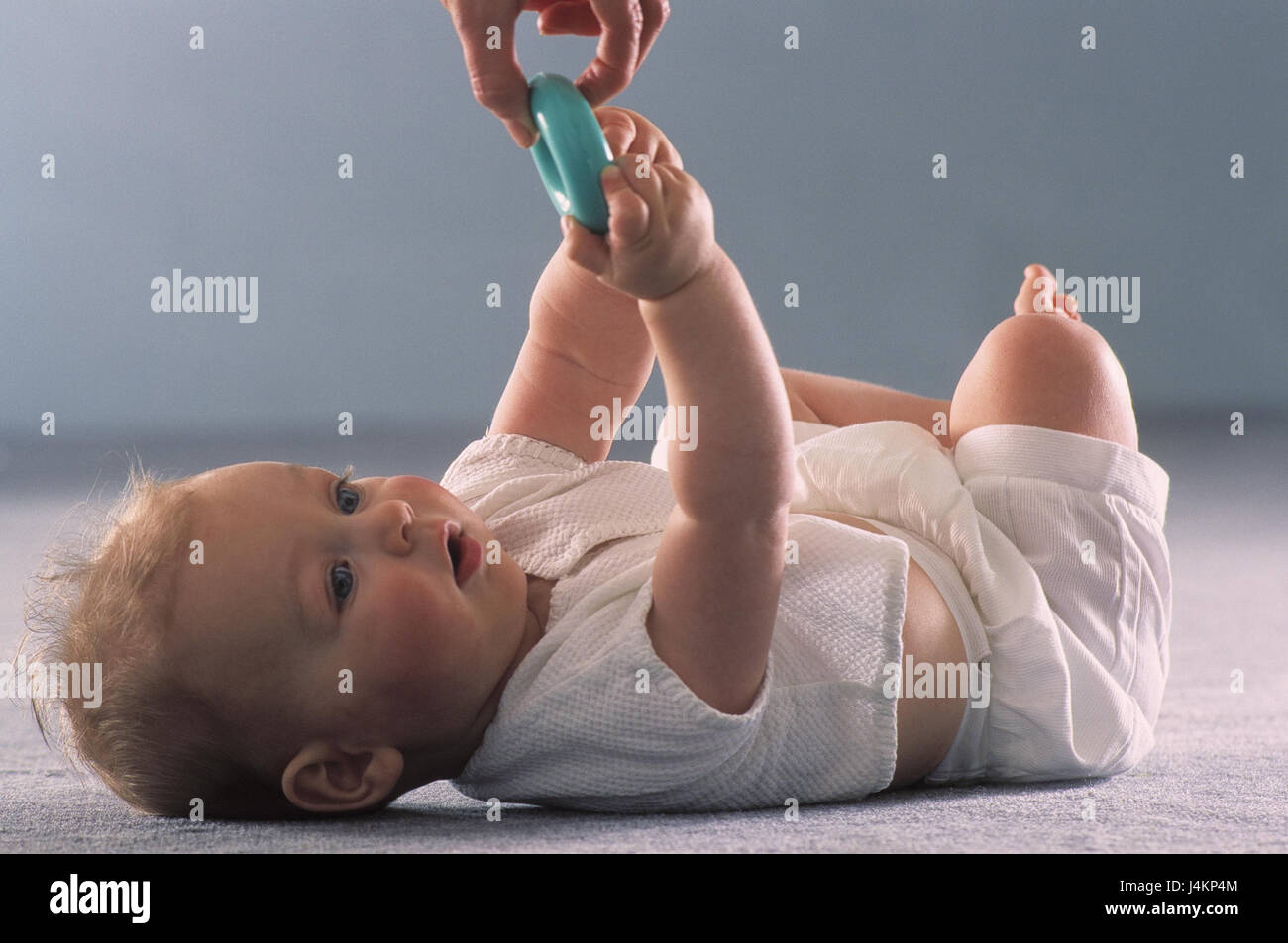 Baby, back position, hands, toys, reach inside, at home, child, infant ...