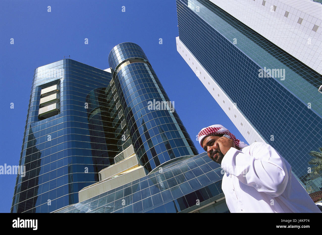 United Arab Emirates, Dubai, business centre, high rises, man, mobile ...
