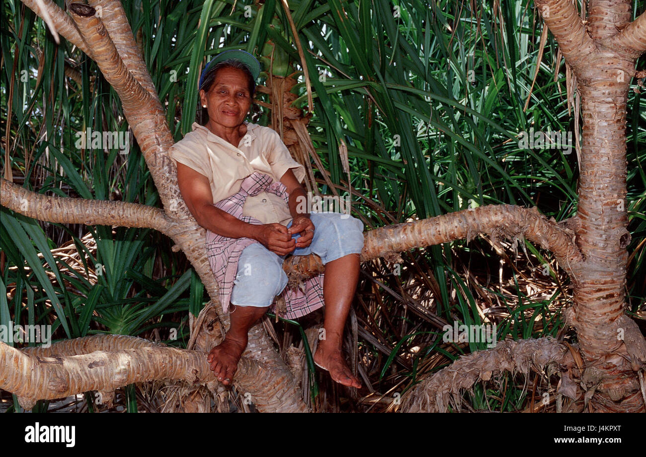 The Philippines, woman, tree, sit Stock Photo - Alamy