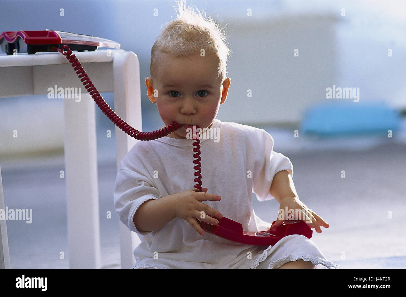 Baby, floor, sit, play telephone cord, mouth at home, child, infant ...