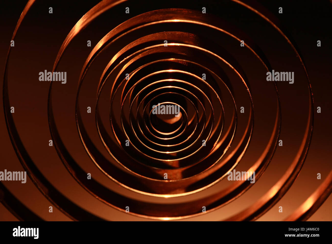 Rusty metal spring closeup on dark background Stock Photo - Alamy