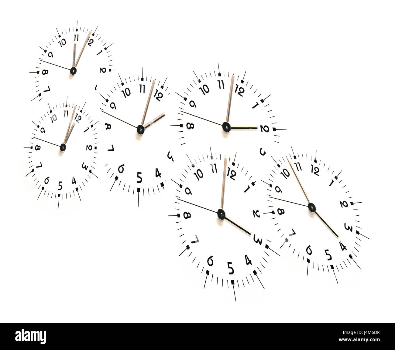 Time concept. Few clock faces from eleven to four hours on white ...
