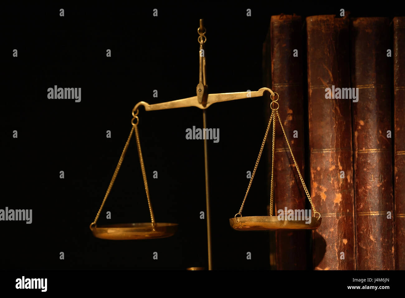 Closeup of old brass weight scale on books background Stock Photo - Alamy
