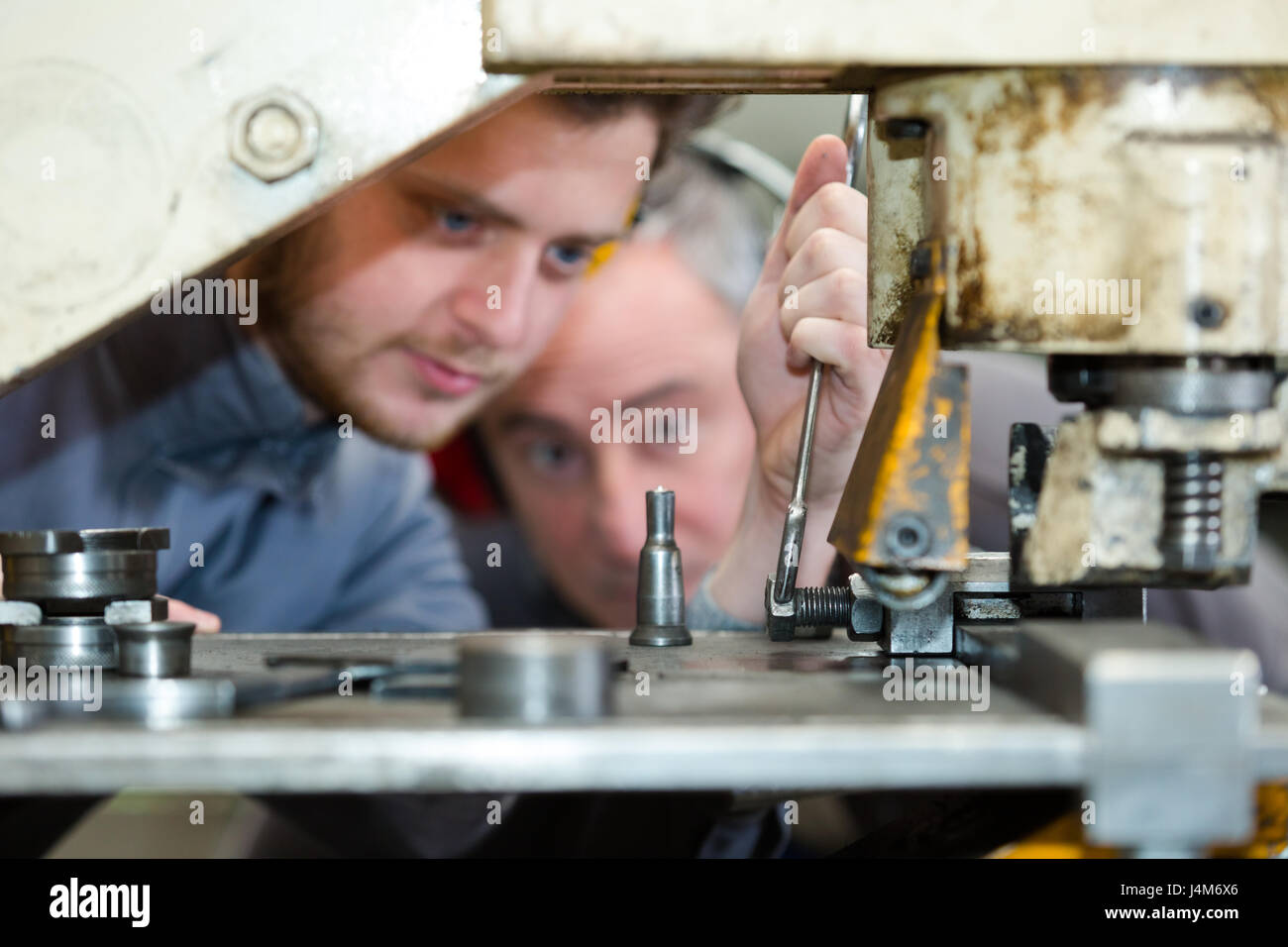 closeup of engineer tightening bolt with spanner Stock Photo - Alamy