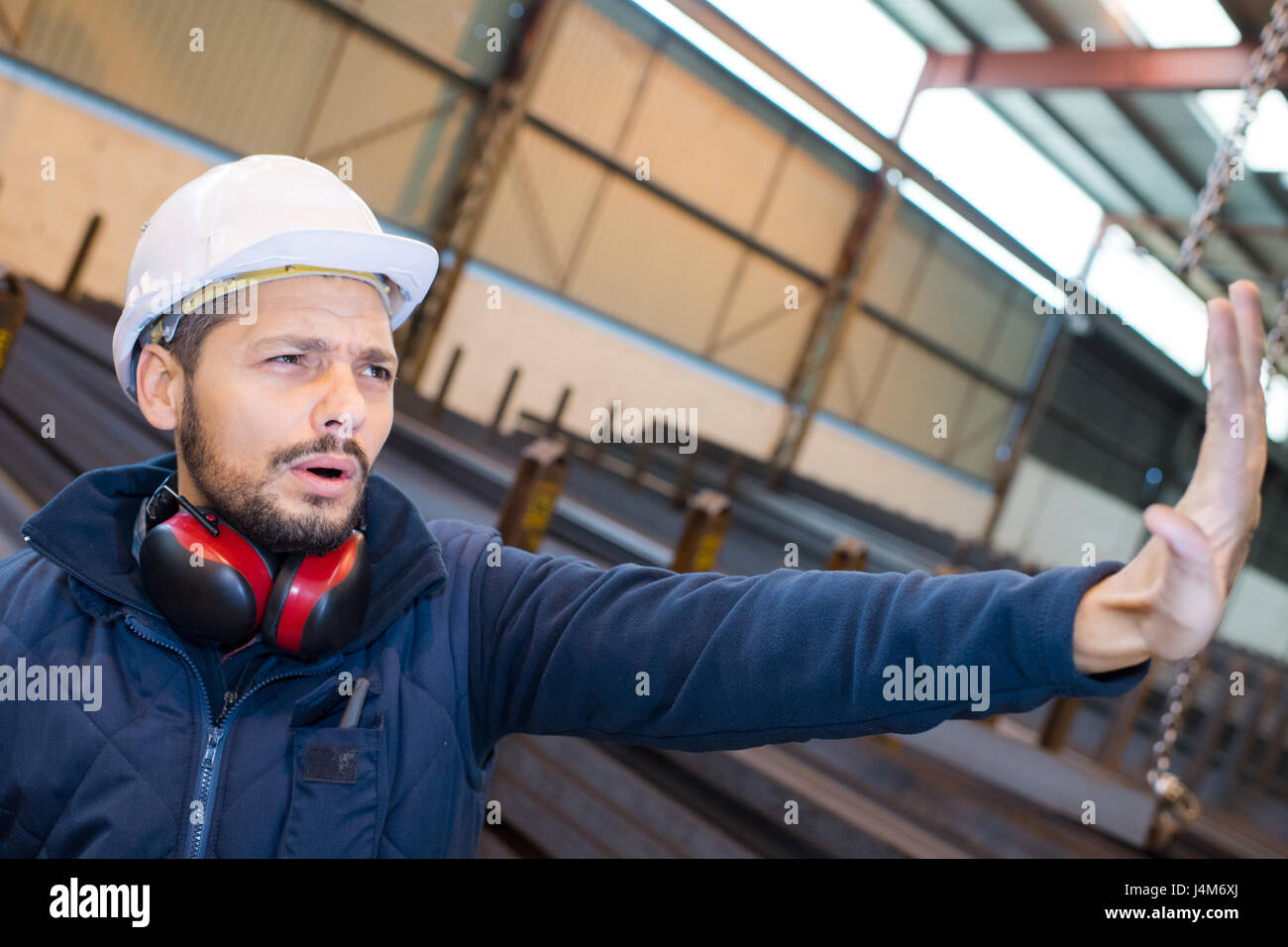 Factory worker making gesture hi-res stock photography and images - Alamy