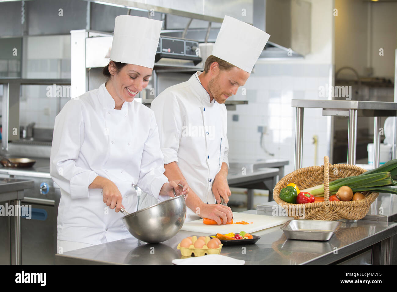team of chefs working in the kitchen Stock Photo - Alamy