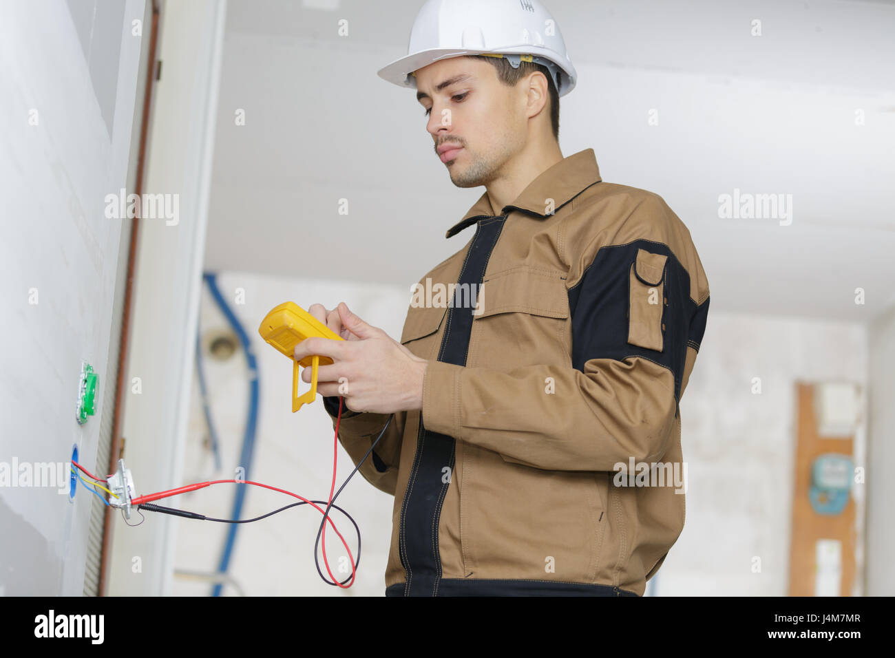 young engineer using a digital multimeter Stock Photo - Alamy