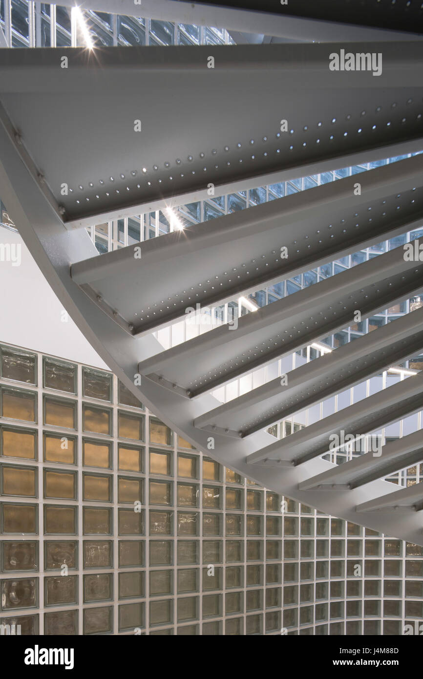 Detail of helical staircase and glass brick facade. Housing Building ...