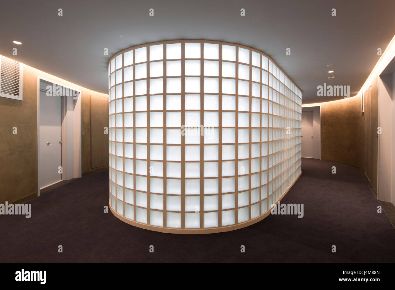 Corridor with internal glass brick lightwell. Housing Building, Quai ...