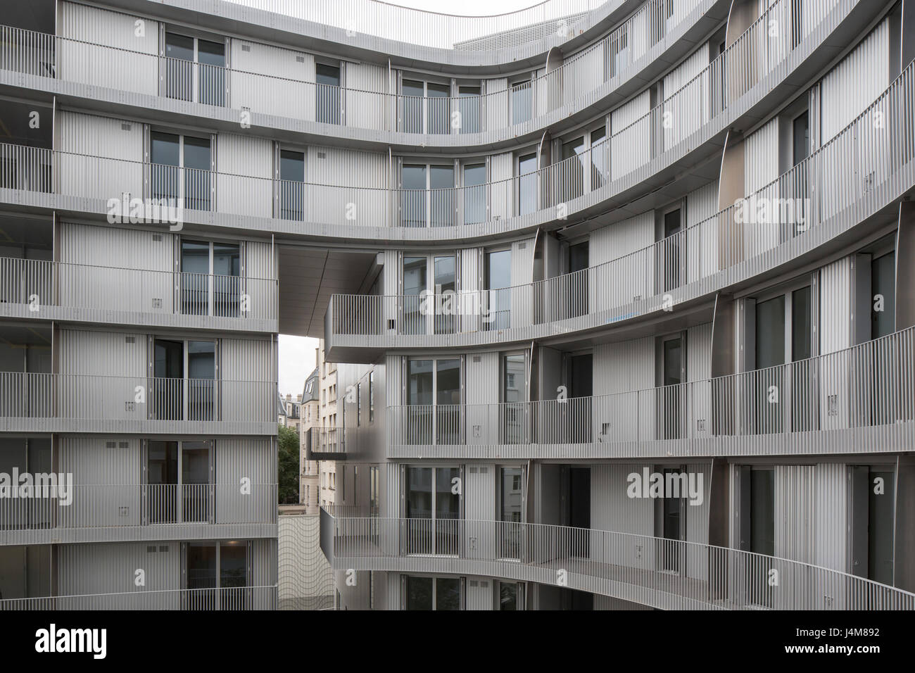 Circulation gap between building facade. Housing Building, Quai Henri ...