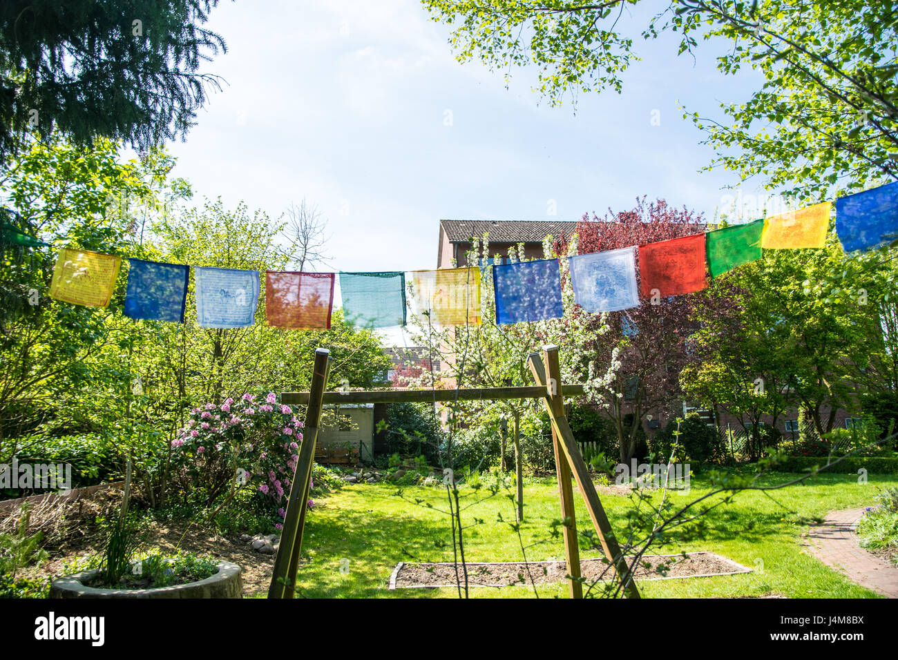 colorful small flags inside an European Garden at spring time Stock ...