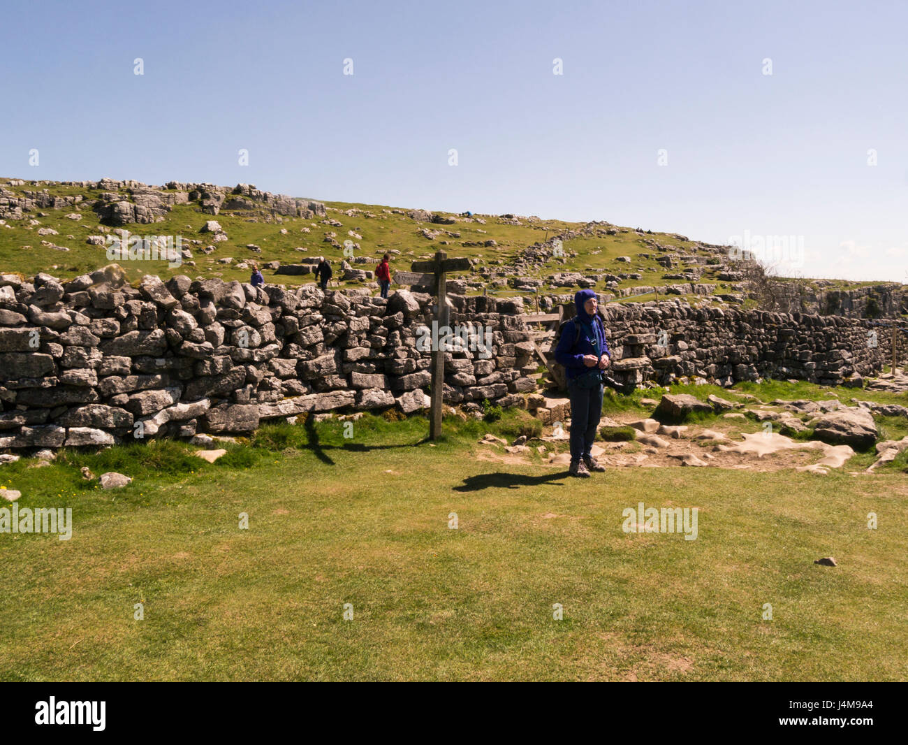 Women walkers on Pennine Way National Trail Malham Cove North Yorkshire ...