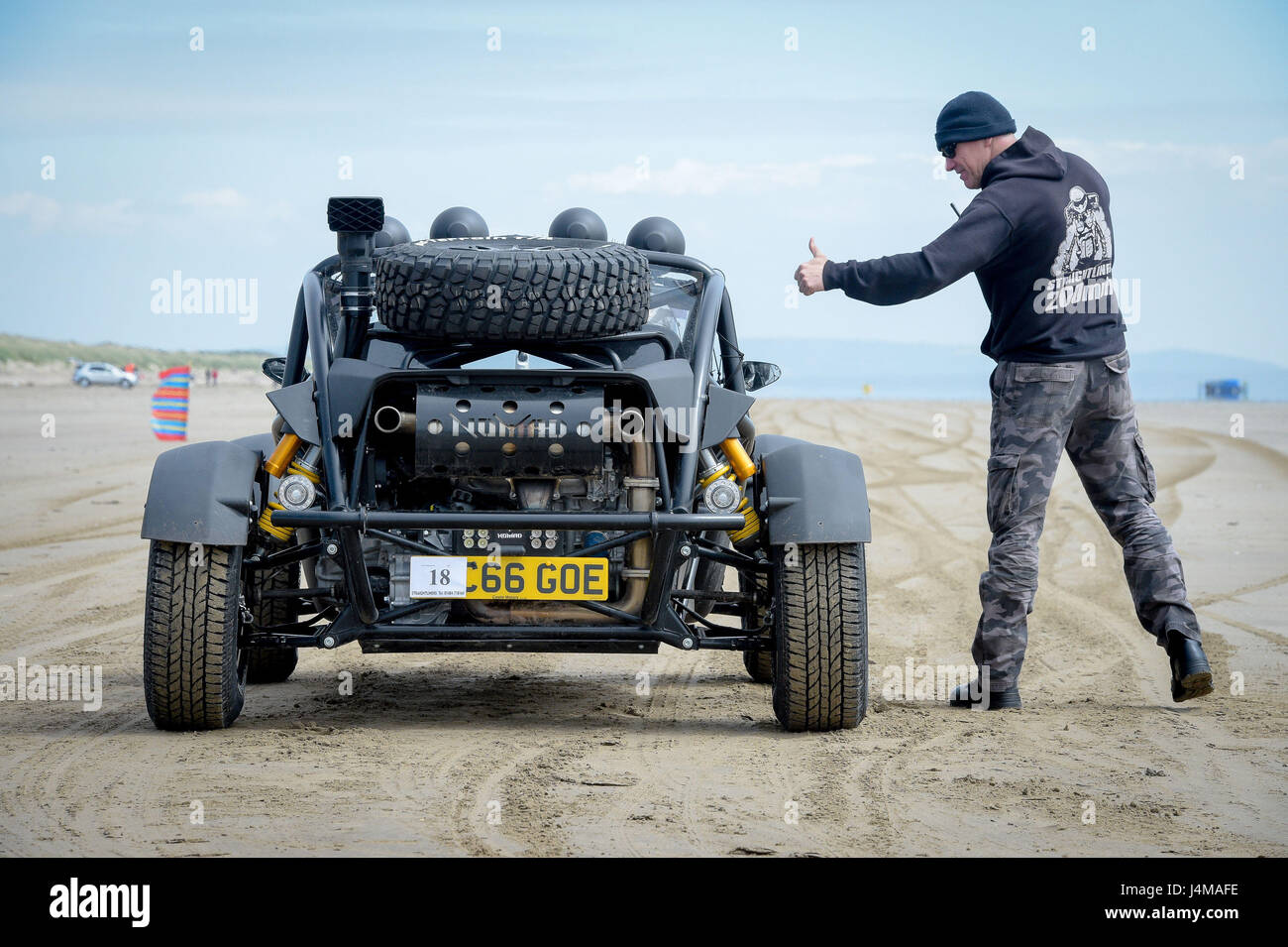 An Atom Nomad off road style vehicle is given the thumbs up to start in ...