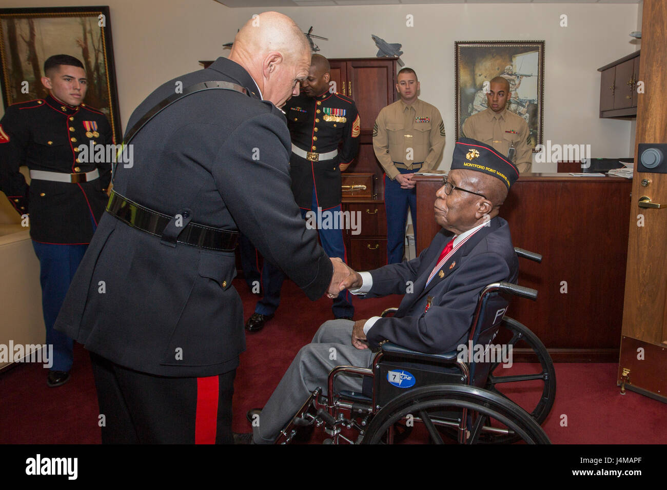 Commandant of the Marine Corps Gen. Robert B. Neller, left, shakes ...