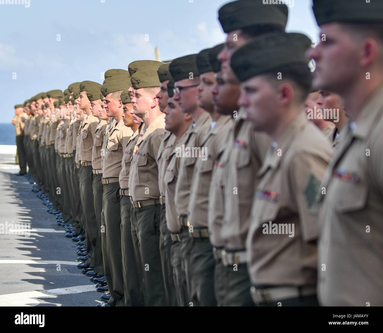 161110-N-BT947-116 SOUTH CHINA SEA (Nov. 10, 2016) Marines stand at ...