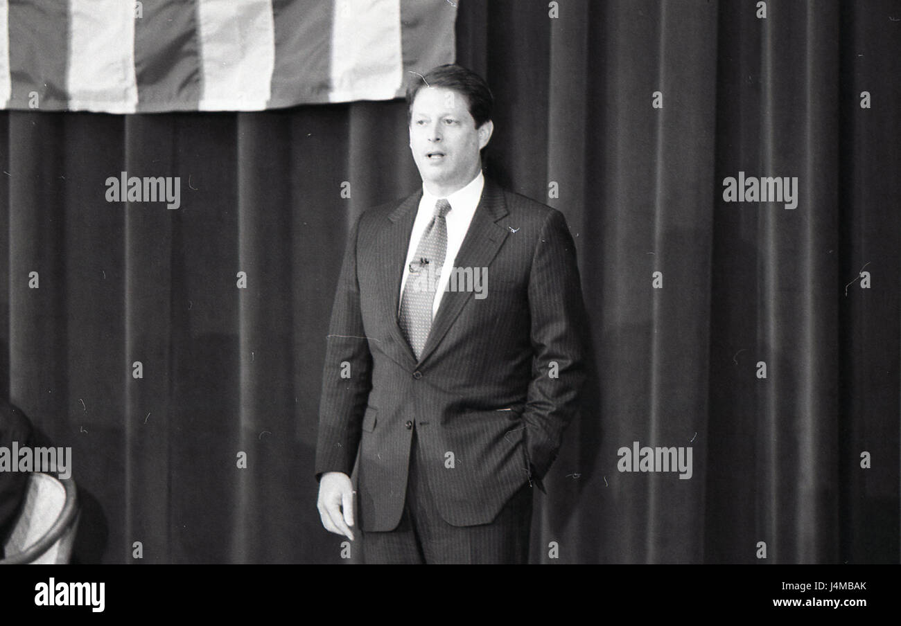 MAN STANDING TALKING TO PEOPLE Stock Photo - Alamy