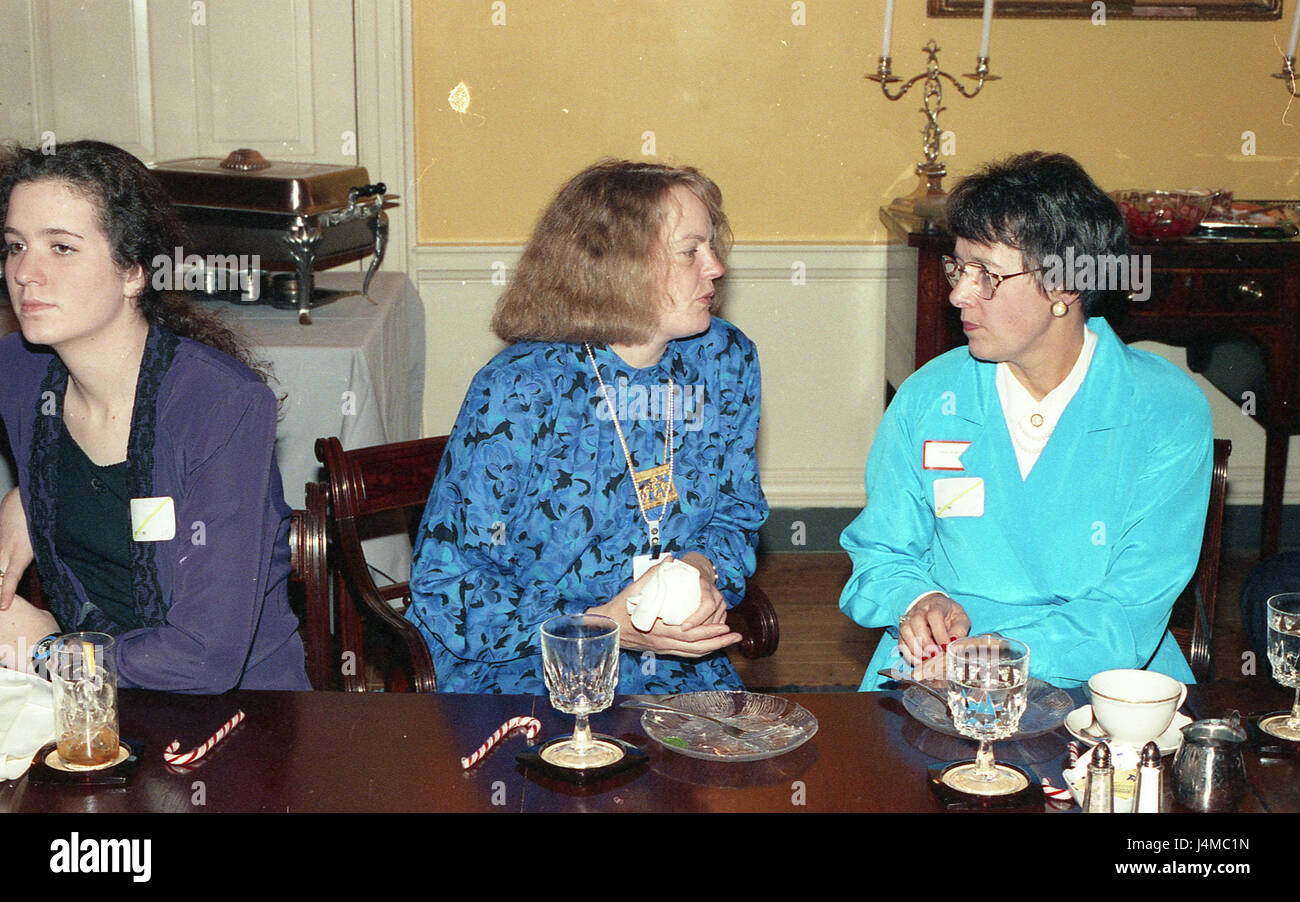 THREE WOMEN ARE HAVING A CONVERSATION AT THE TABLE Stock Photo - Alamy