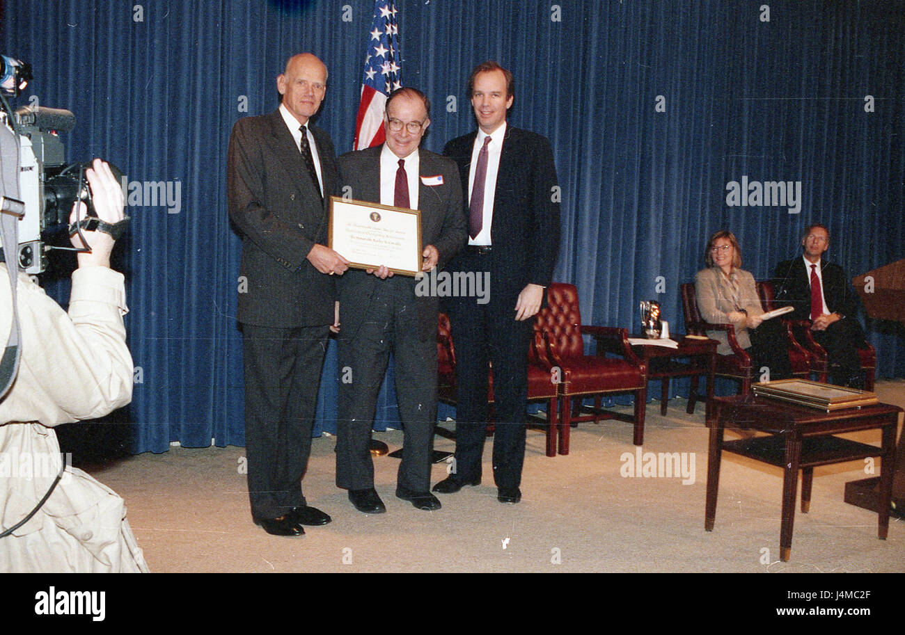 THREE MEN STANDING WITH A AWARD IN THERE HAND Stock Photo - Alamy