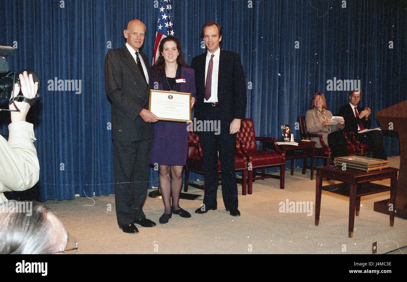 TWO MEN AND A WOMAN ON STAGE WITH A AWARD Stock Photo - Alamy