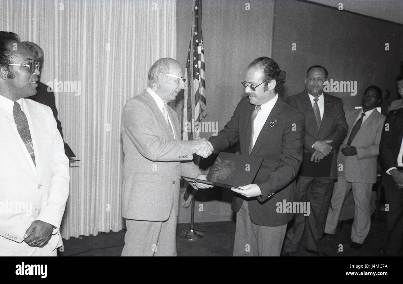 A MAN SHAKING ANOTHER MAN'S HAND - RECEIVING AN AWARD Stock Photo - Alamy