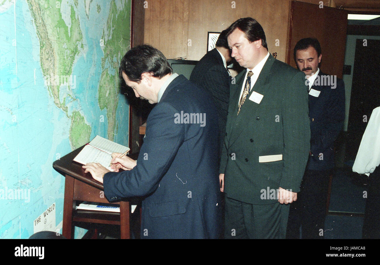 MEN SIGNING A BOOK Stock Photo - Alamy