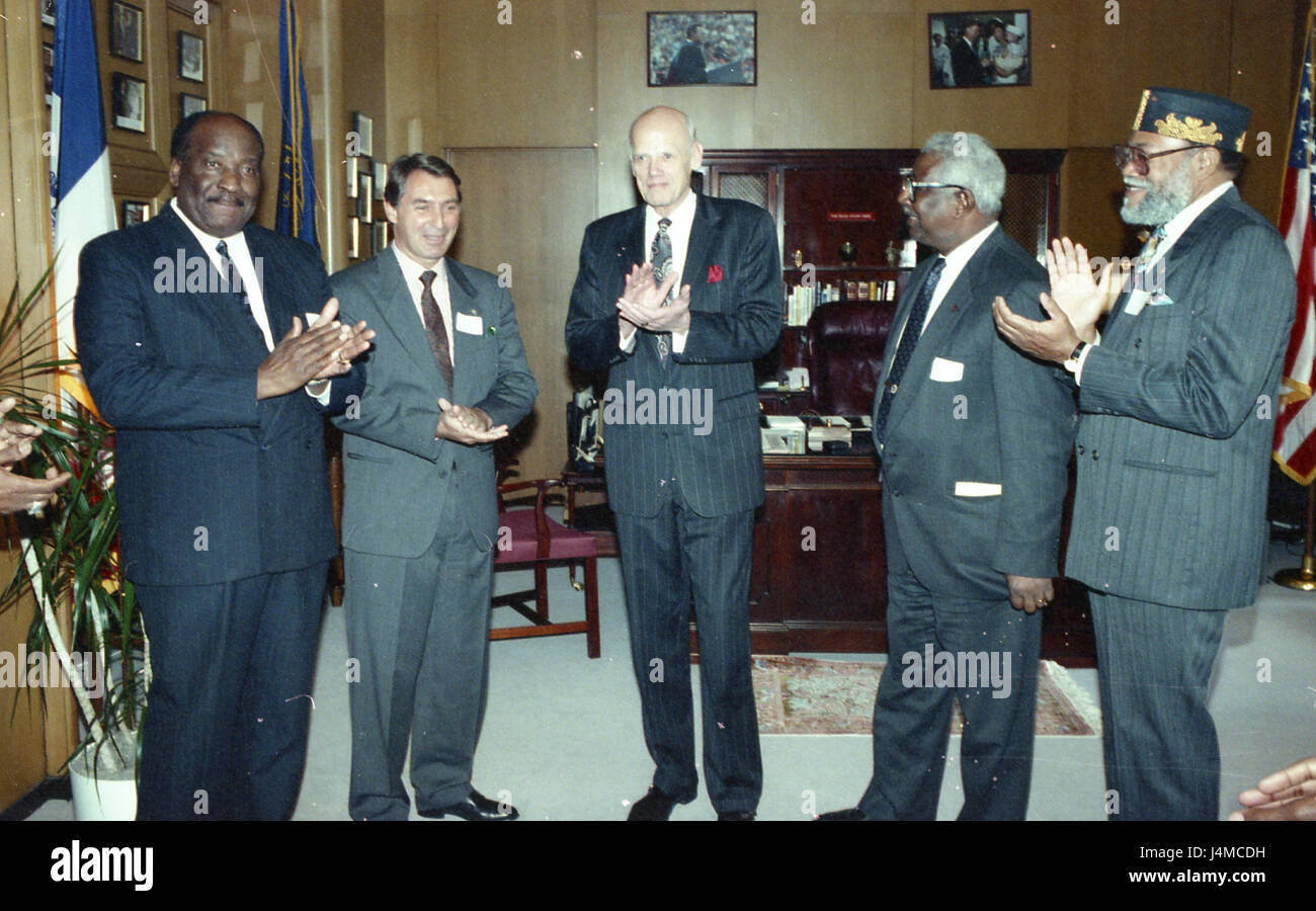 FIVE MEN ARE STANDING IN THE OFFICE CLAPPING THERE HANDS Stock Photo ...