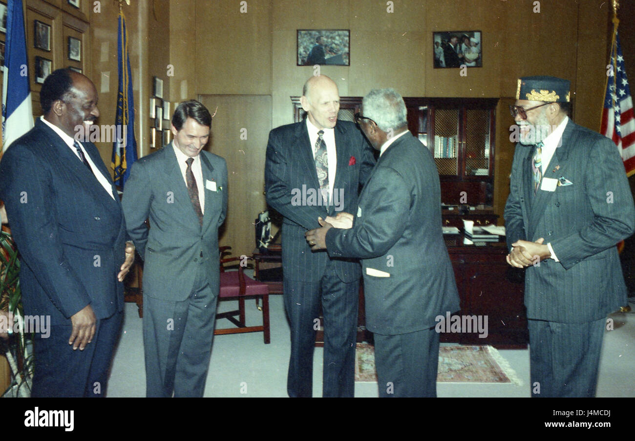 FIVE MEN ARE HAVING A CONVERSATION WITH A HAND SHACK Stock Photo - Alamy