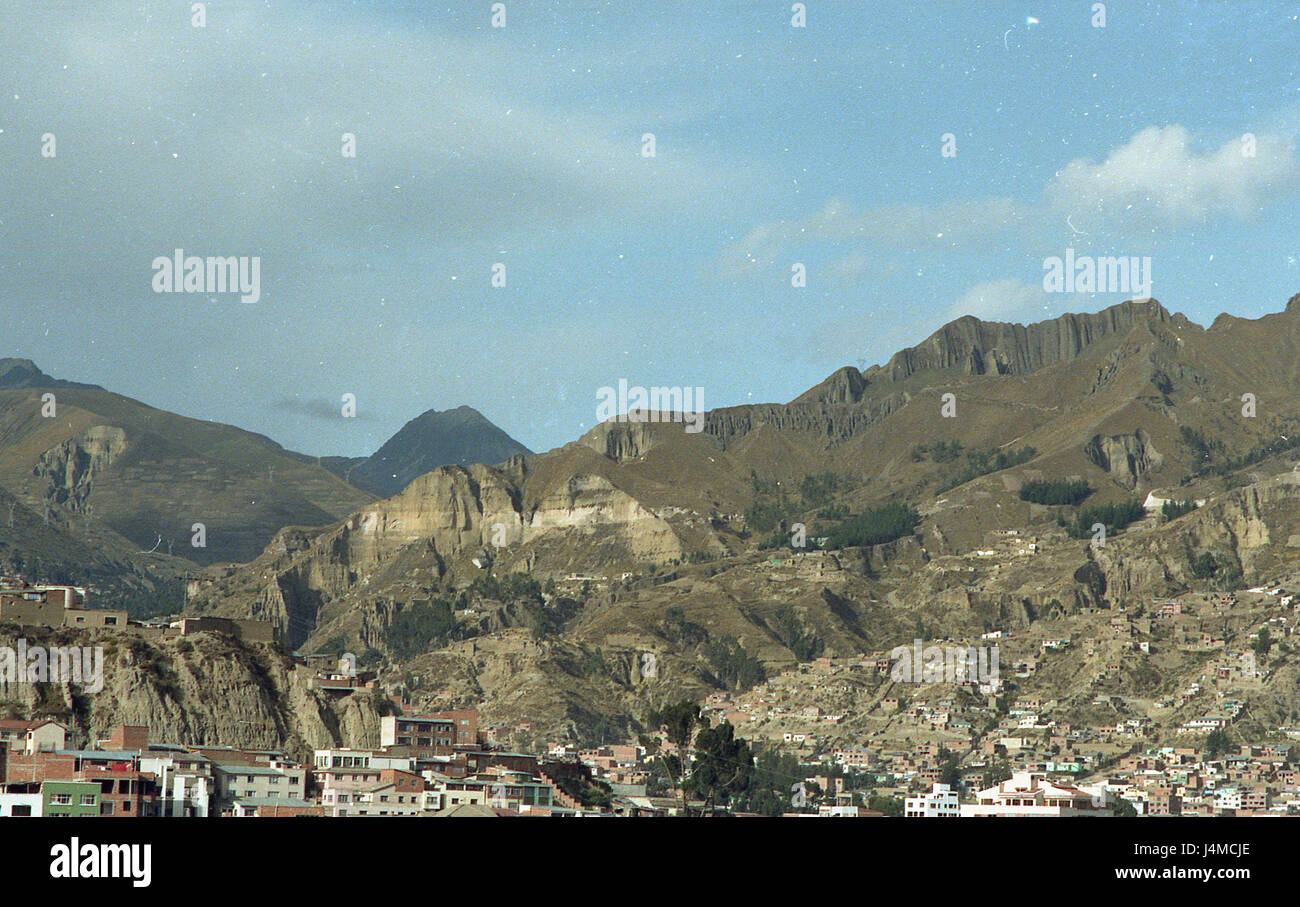 An elevated view shows a broad landscape featuring natural terrain ...