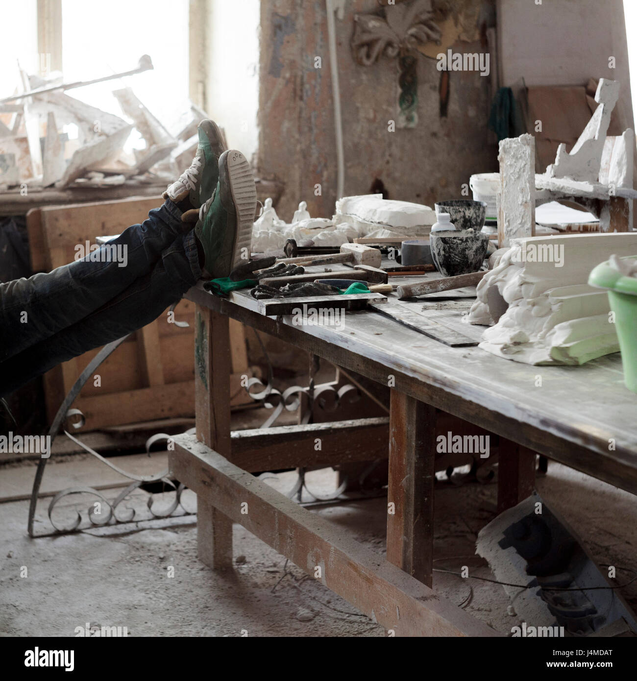 Man sitting with feet up on table hi-res stock photography and images ...