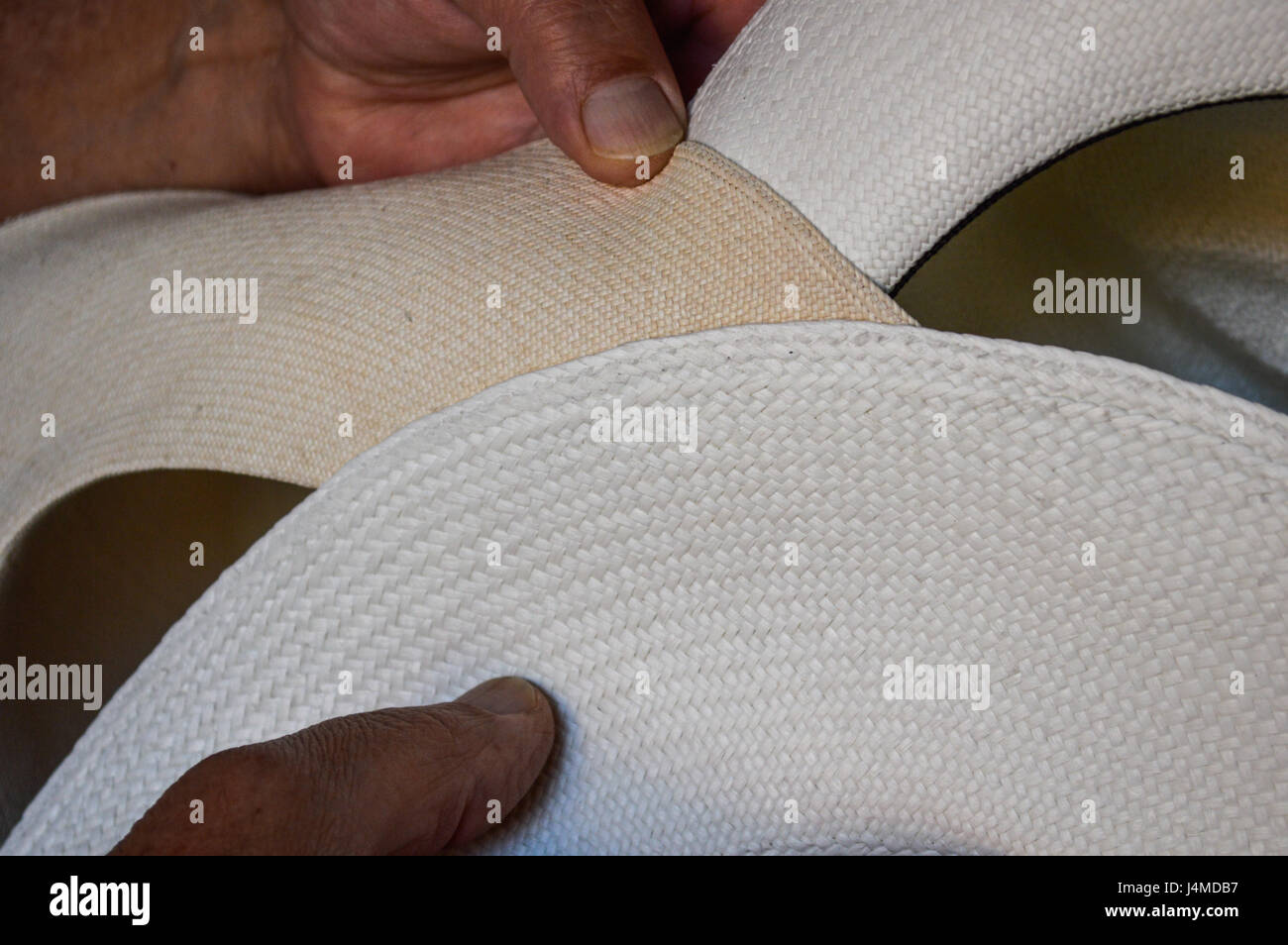 Artisan showing the different weaving quality patterns of the famous ...