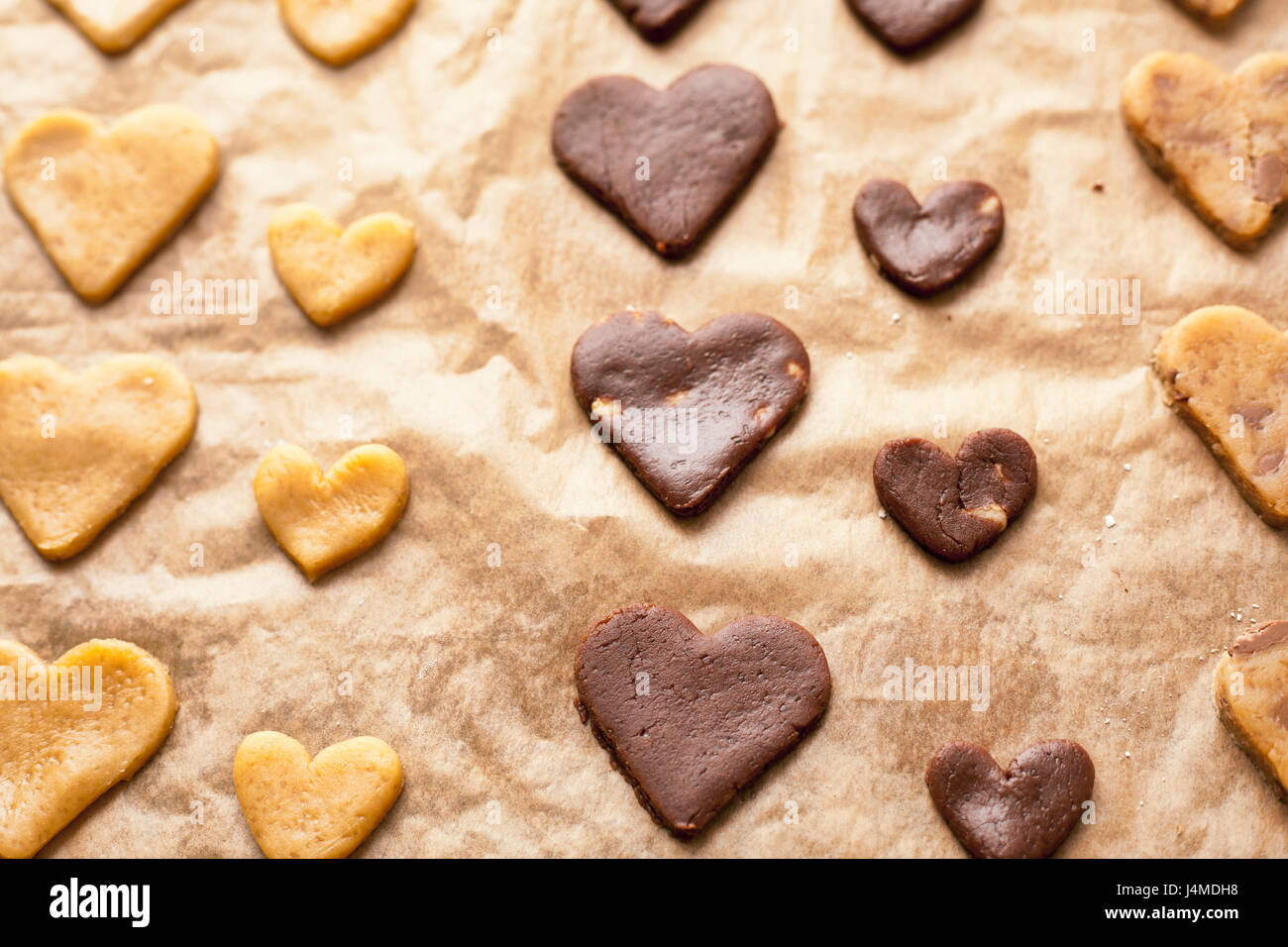 Heart-shape cookies on baking sheet Stock Photo - Alamy