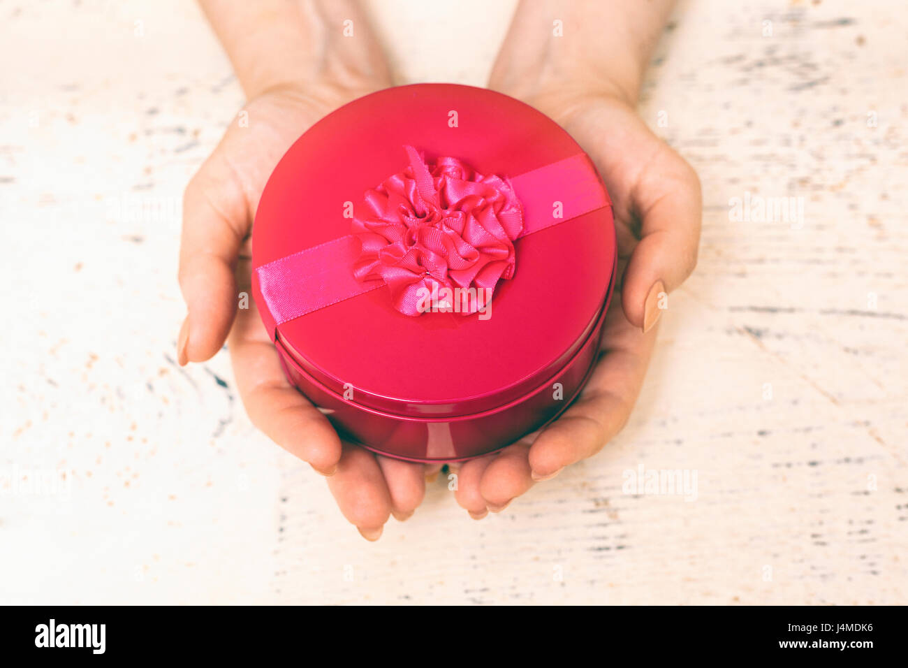 Female hands holding wooden box hi-res stock photography and images - Alamy