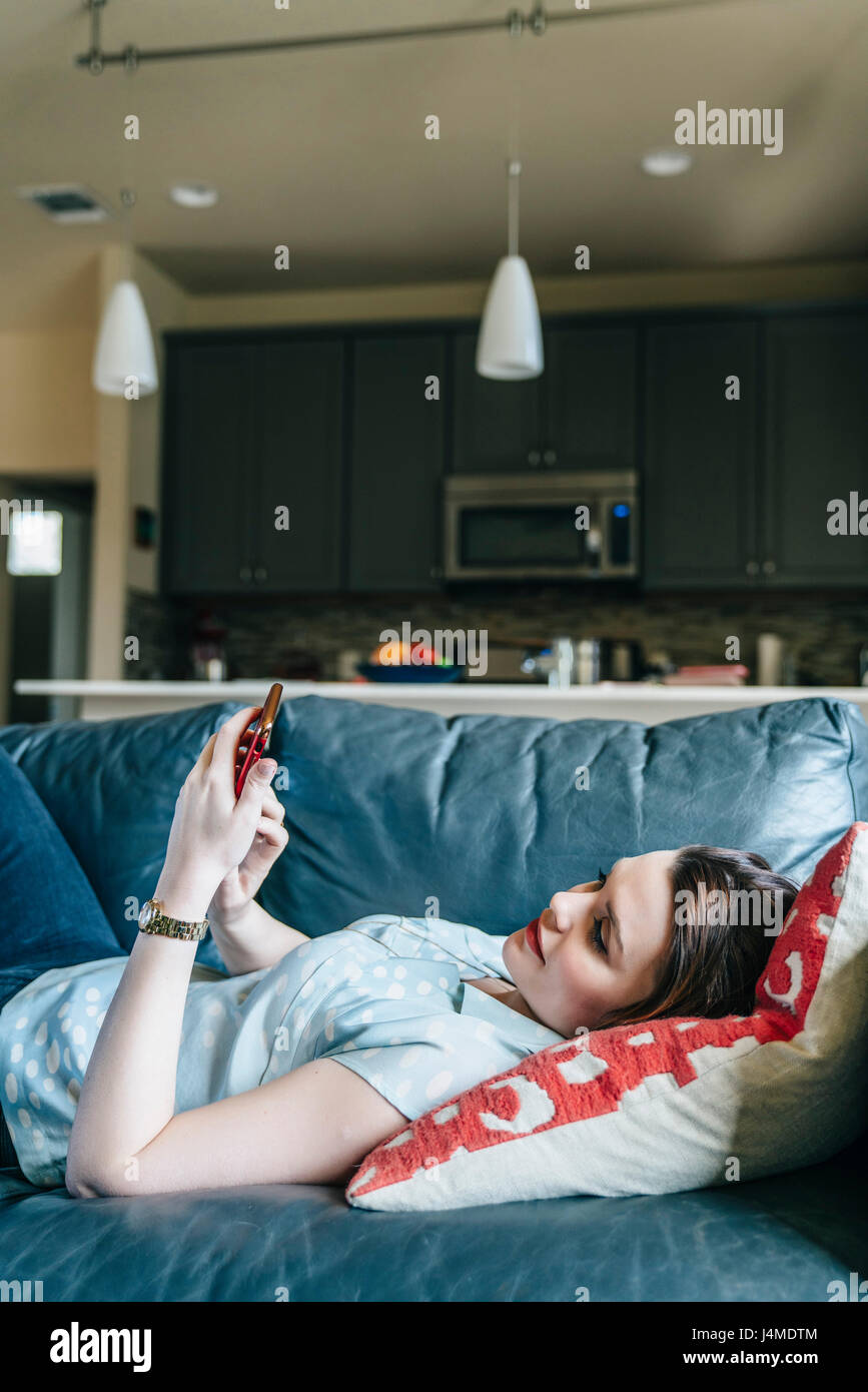 Woman laying sofa hi-res stock photography and images - Alamy