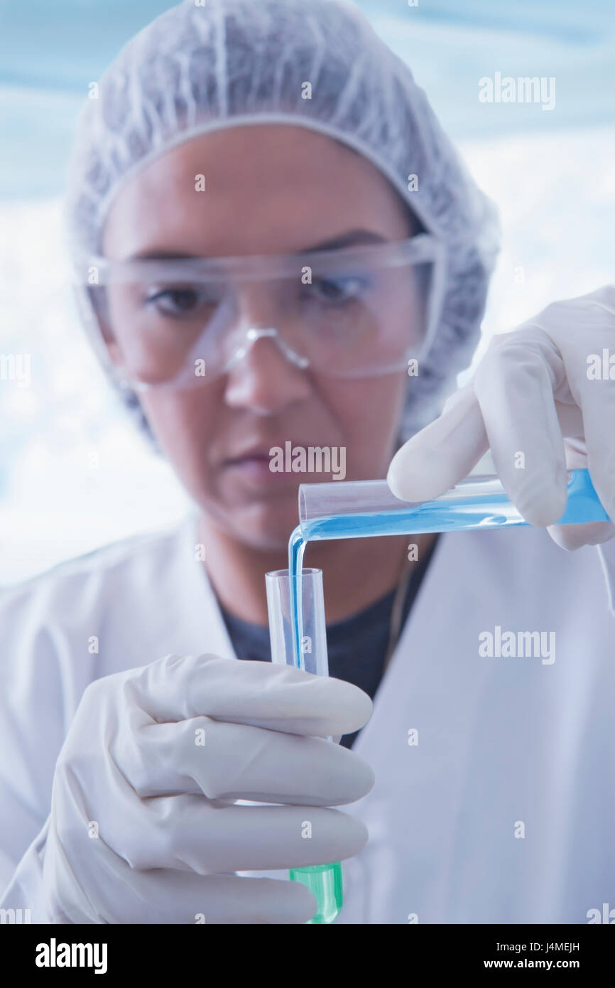 Hispanic scientist pouring liquid into test tube Stock Photo - Alamy Hispanic scientist pouring liquid into test tube Stock Photo - Alamy