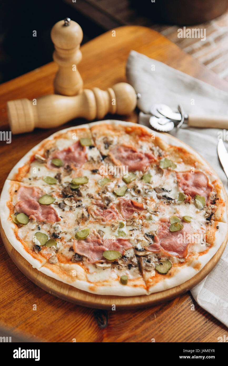 Pizza pie on table Stock Photo - Alamy