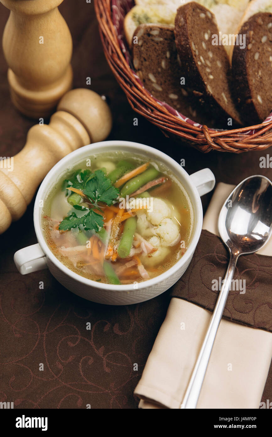 Cup of soup with bread Stock Photo - Alamy