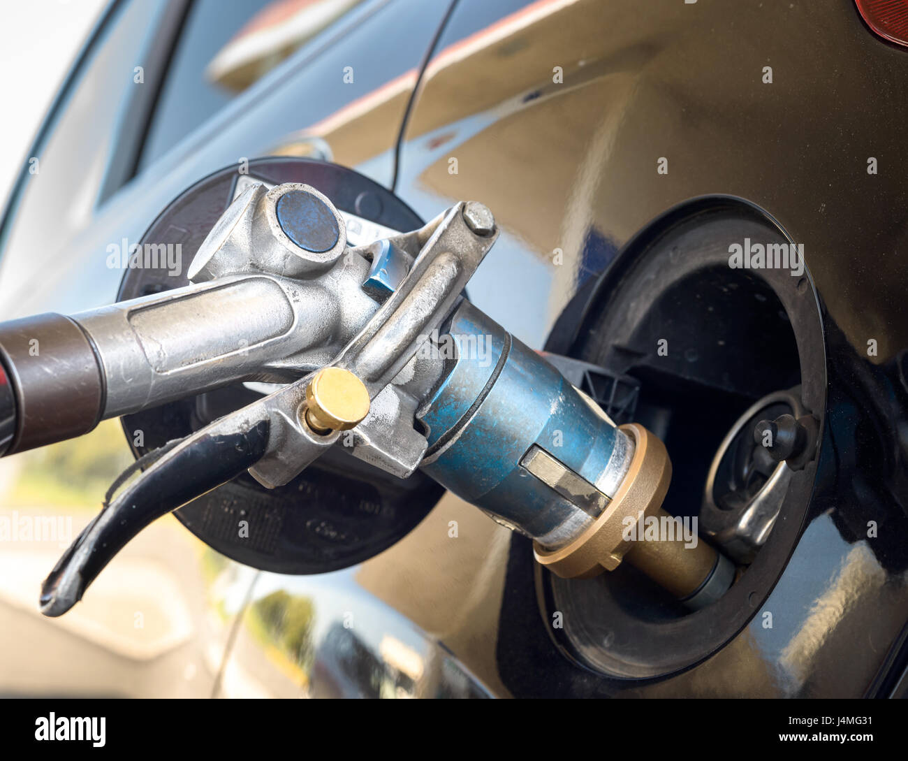 Fuel gun during liquid gas propane refill Stock Photo - Alamy
