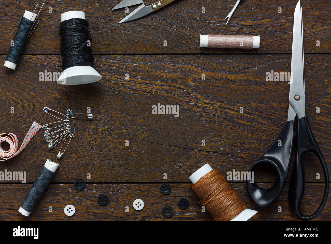 Top view tailor items on wooden background with copy space Stock Photo ...