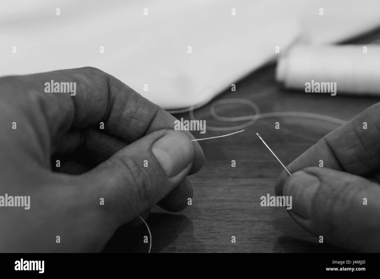 Woman threading Black and White Stock Photos & Images - Alamy