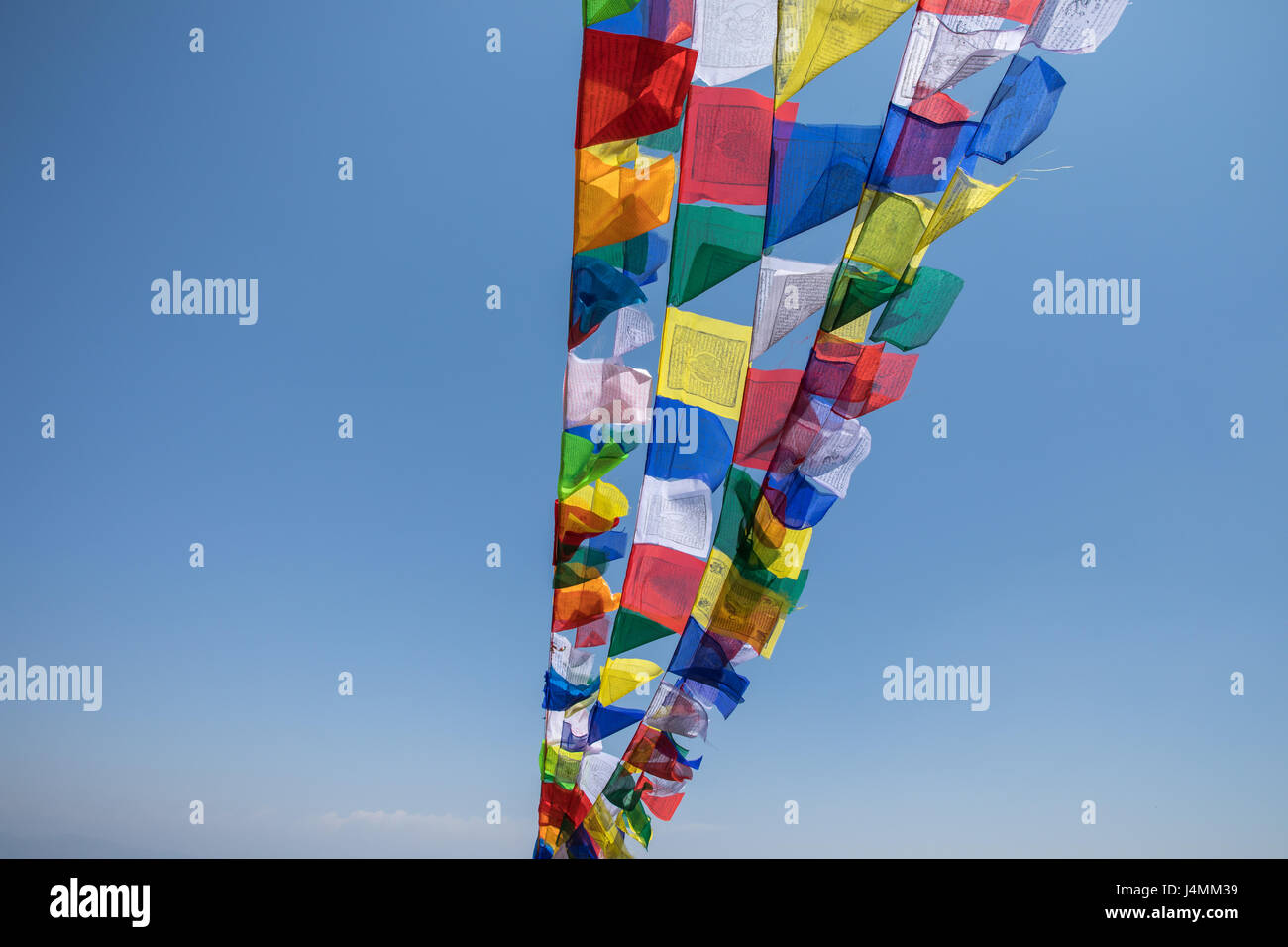 Colorful prayer flag mountain near ancient and holy Namobuddha ...