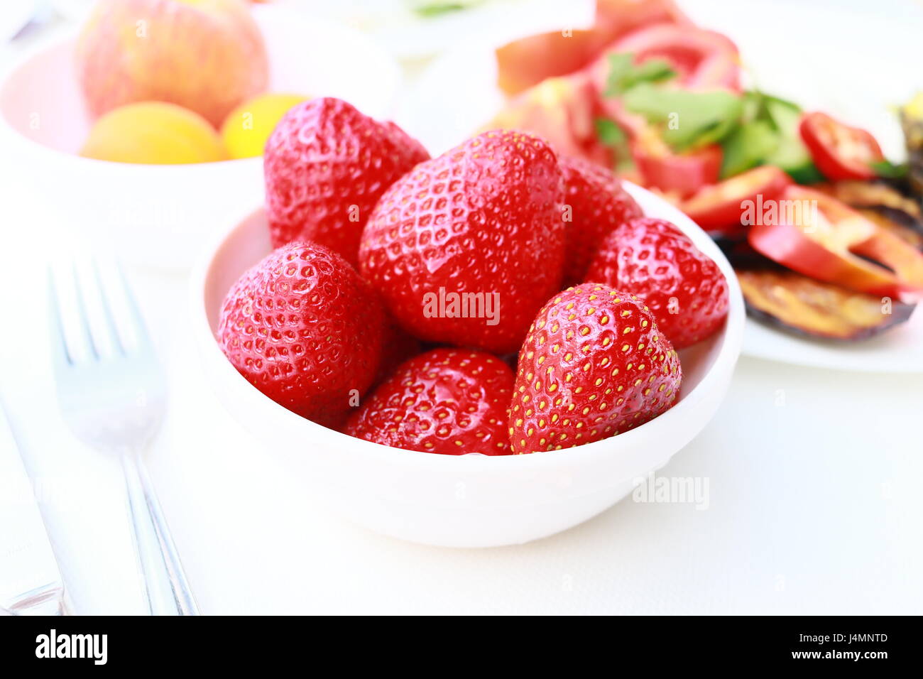 Breakfast - fresh strawberries on table Stock Photo - Alamy