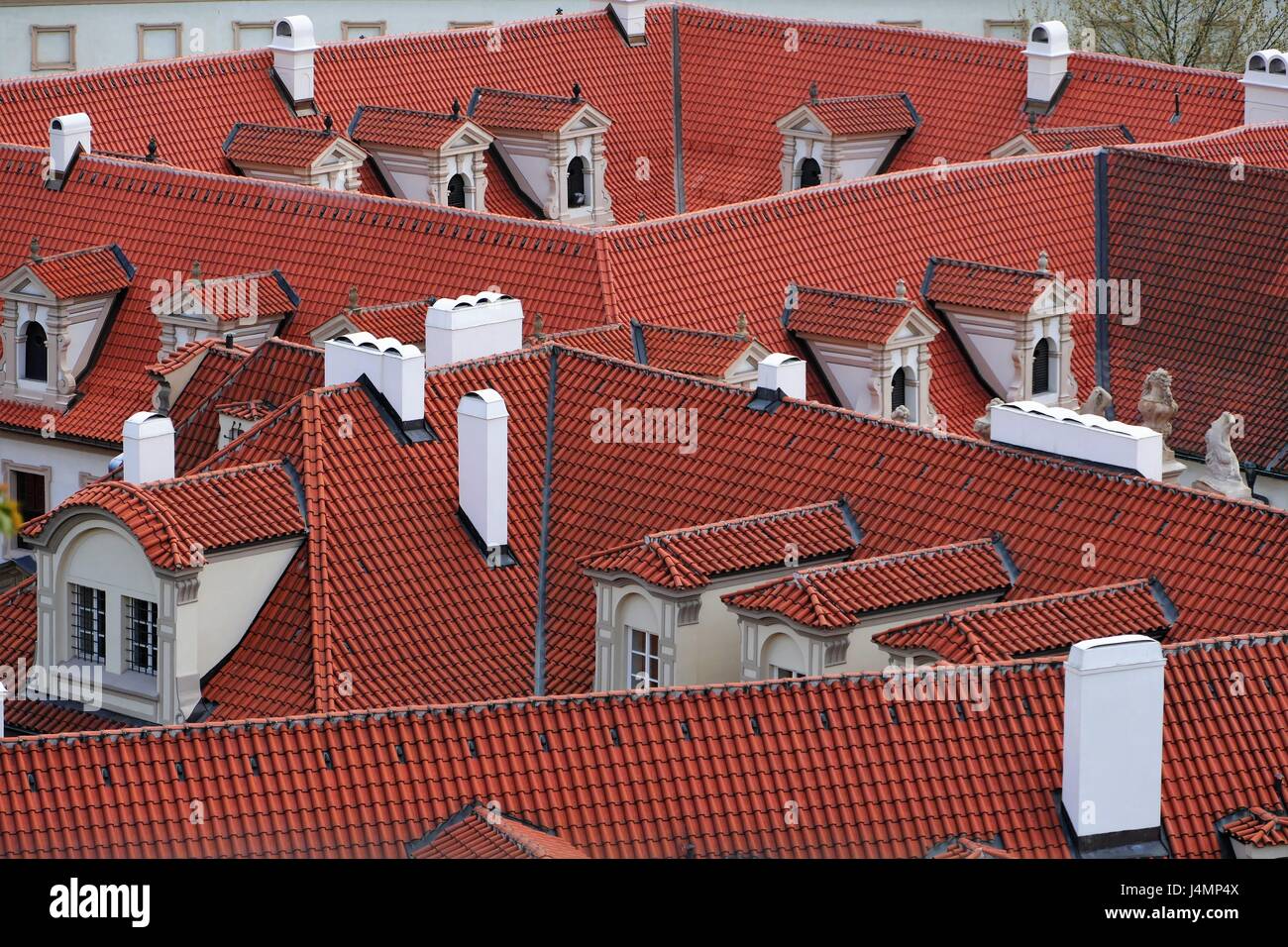 View of rooftops and white chimney's from the heights of Prague Castle ...