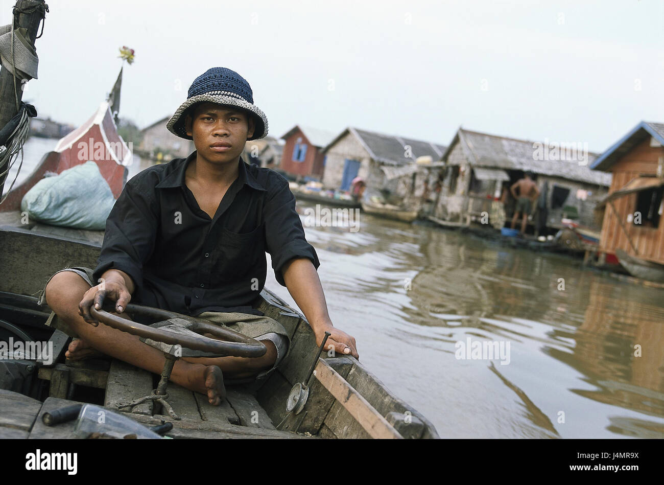 Cambodia, Siem Reap, Tonle Sap, man, boot no model release, South-East ...