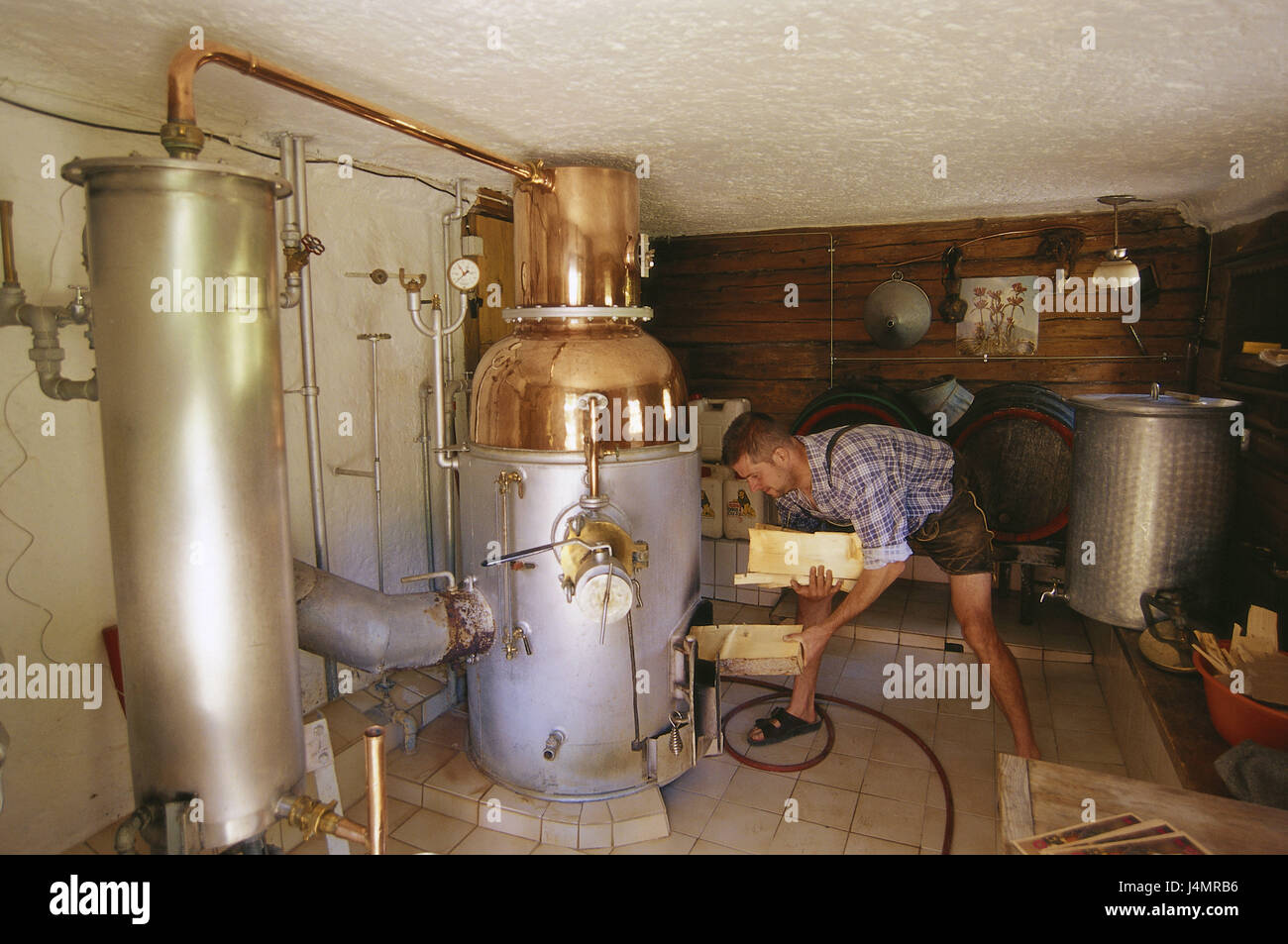 Germany, Berchtesgadener alps, schnapps distillery, man, leather ball ...