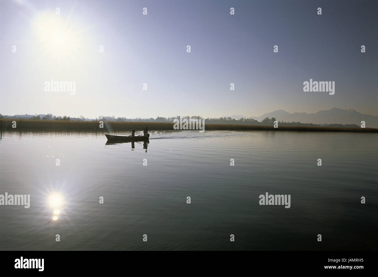 Germany, Upper Bavaria, Lake Chiem, fishing boat, silhouette, back ...