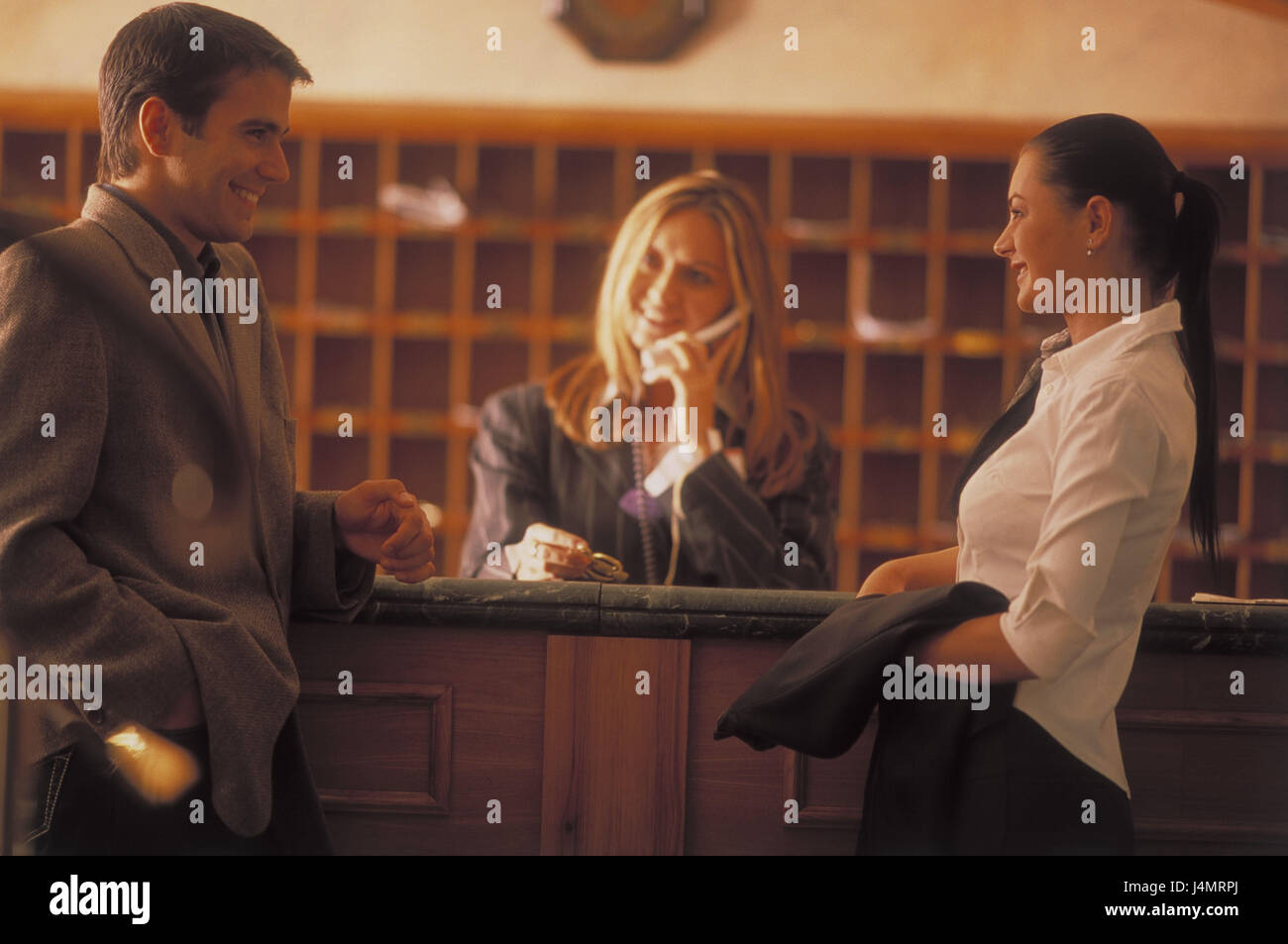 Hotel, reception desk, couple, young, check in, smile hotel reception ...